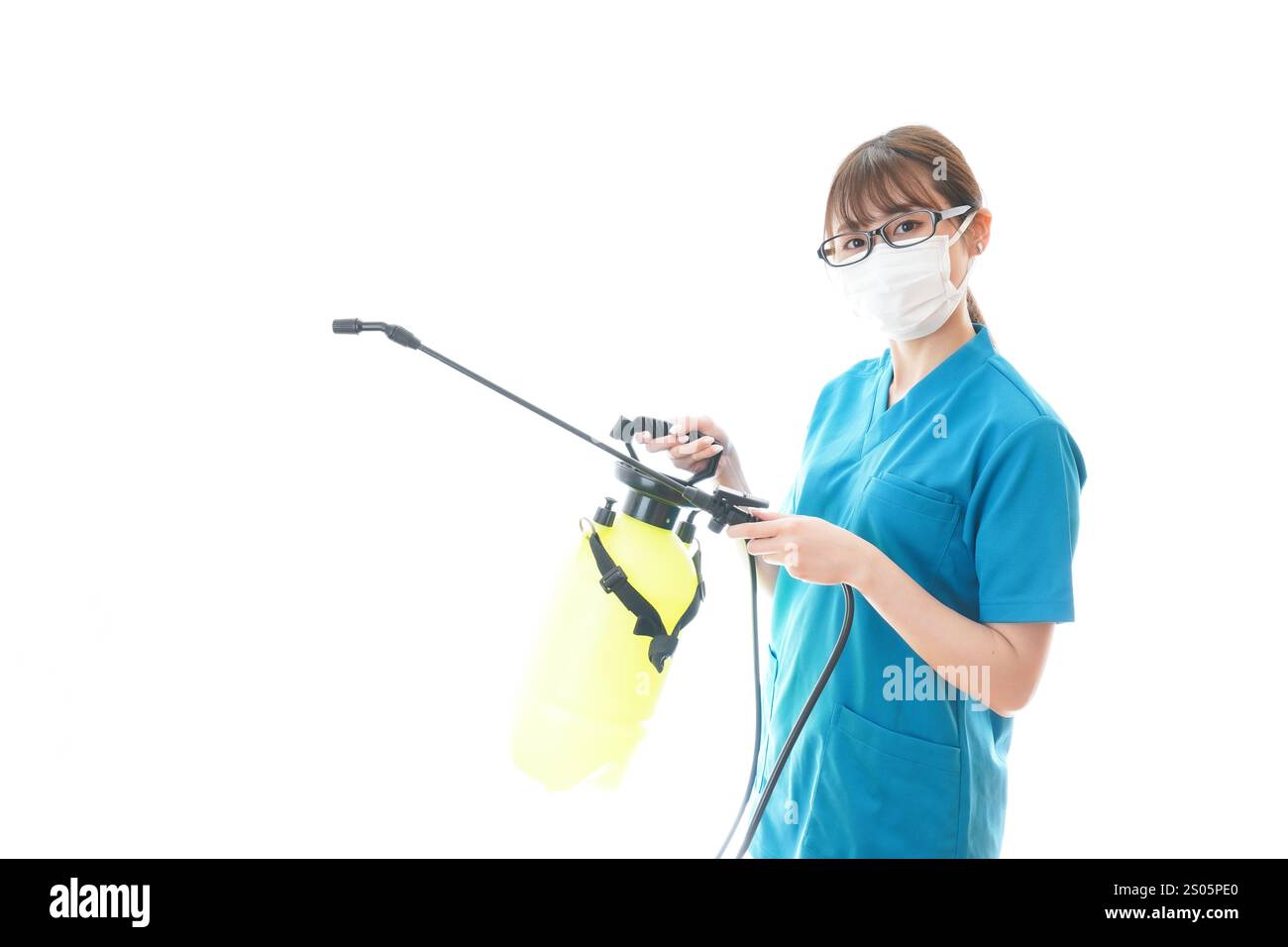 Medical personnel spraying disinfectant solution Stock Photo - Alamy