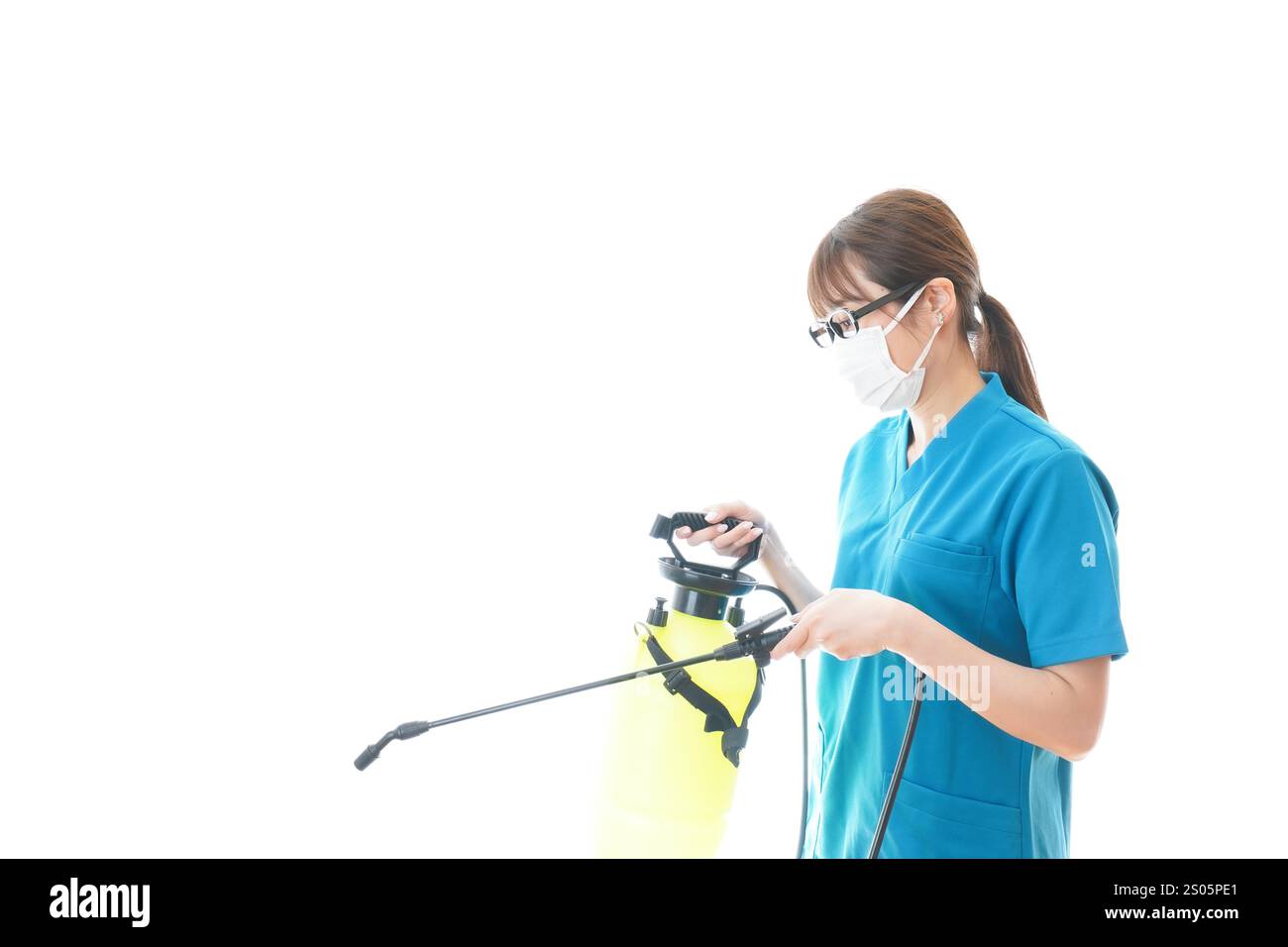 Medical personnel spraying disinfectant solution Stock Photo - Alamy