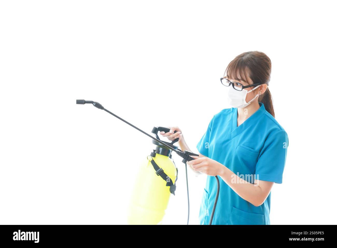Medical personnel spraying disinfectant solution Stock Photo - Alamy