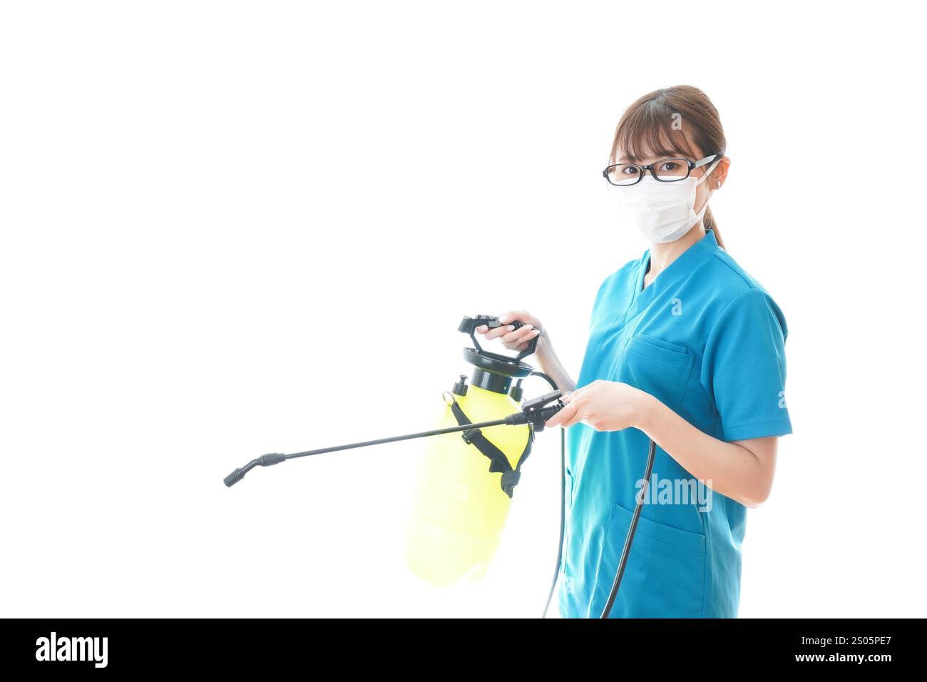 Medical personnel spraying disinfectant solution Stock Photo - Alamy