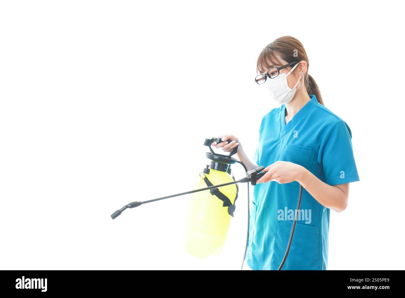 Medical personnel spraying disinfectant solution Stock Photo - Alamy