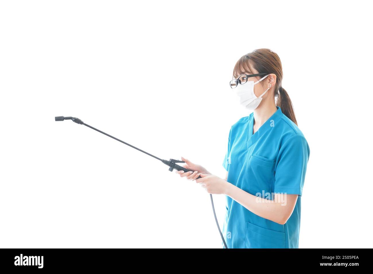 Medical personnel spraying disinfectant solution Stock Photo - Alamy