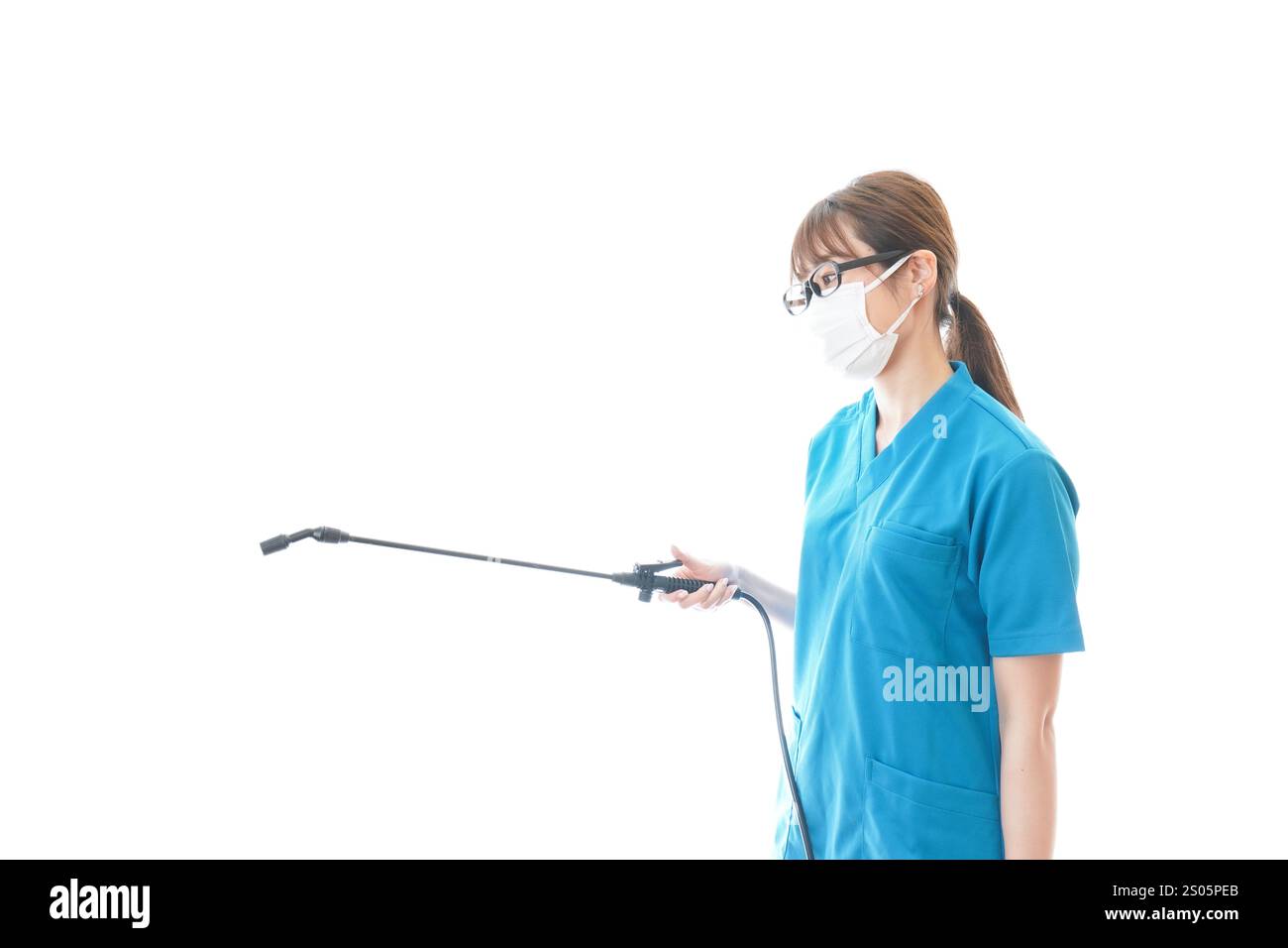 Medical personnel spraying disinfectant solution Stock Photo - Alamy
