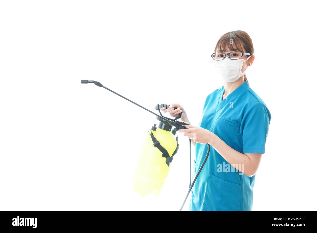 Medical personnel spraying disinfectant solution Stock Photo - Alamy
