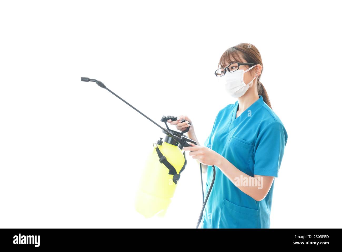Medical personnel spraying disinfectant solution Stock Photo - Alamy
