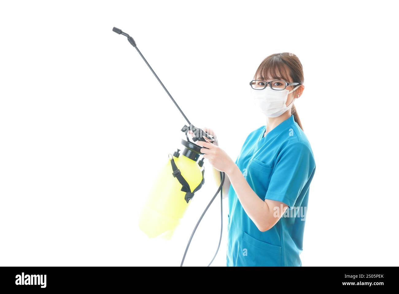 Medical personnel spraying disinfectant solution Stock Photo - Alamy