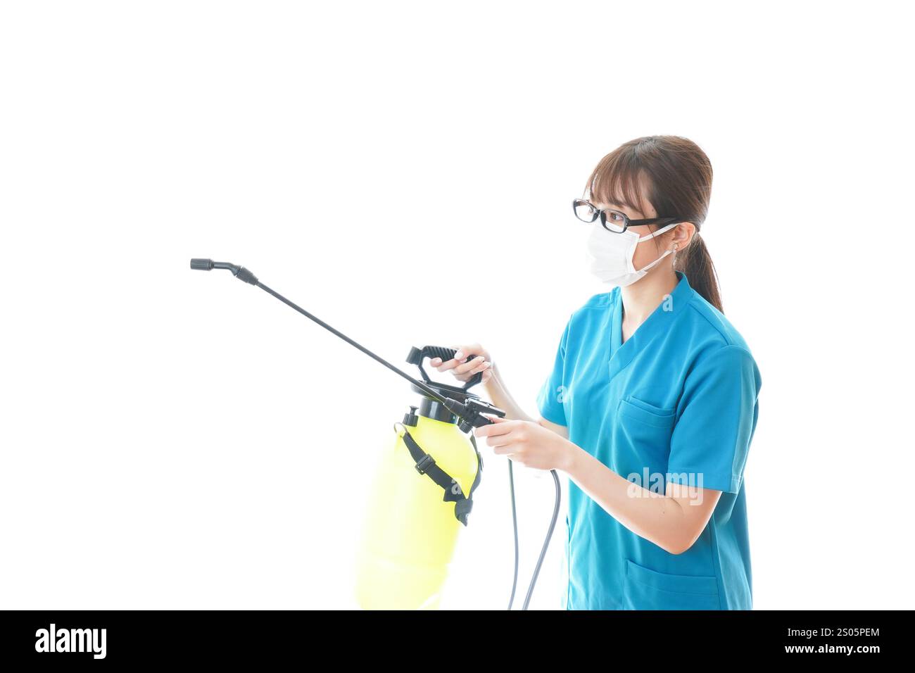 Medical personnel spraying disinfectant solution Stock Photo - Alamy