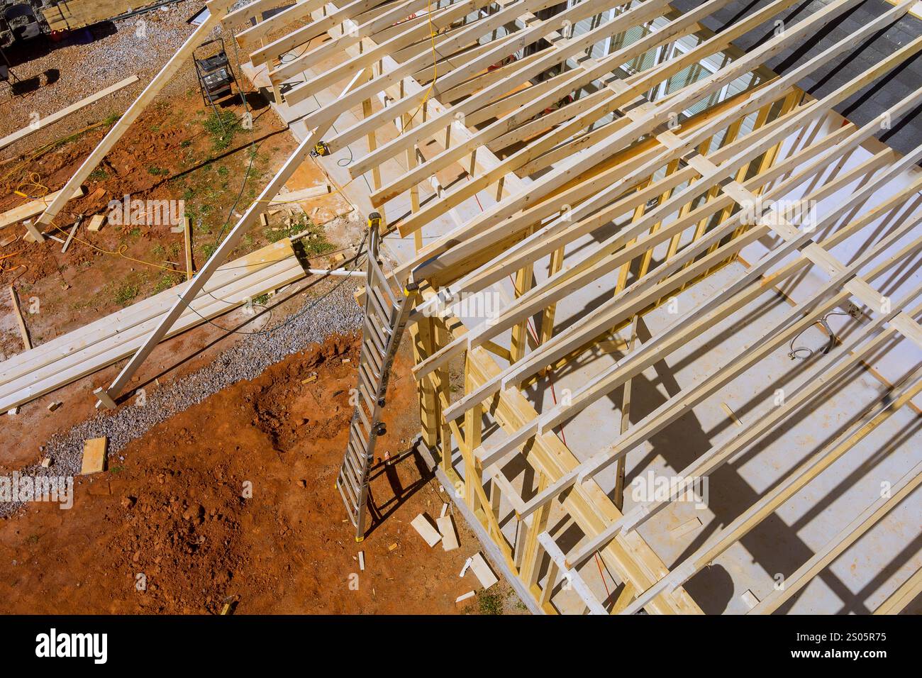 Workers are constructing wooden frame at building site, roofing frame ...