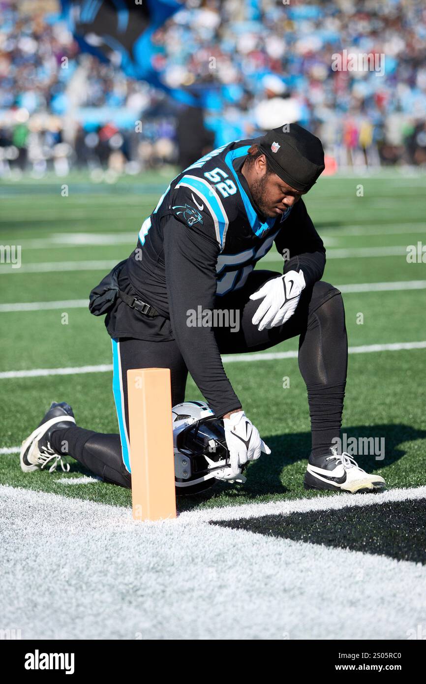 Carolina Panthers linebacker DJ Johnson (52) kneels in the endzone and ...