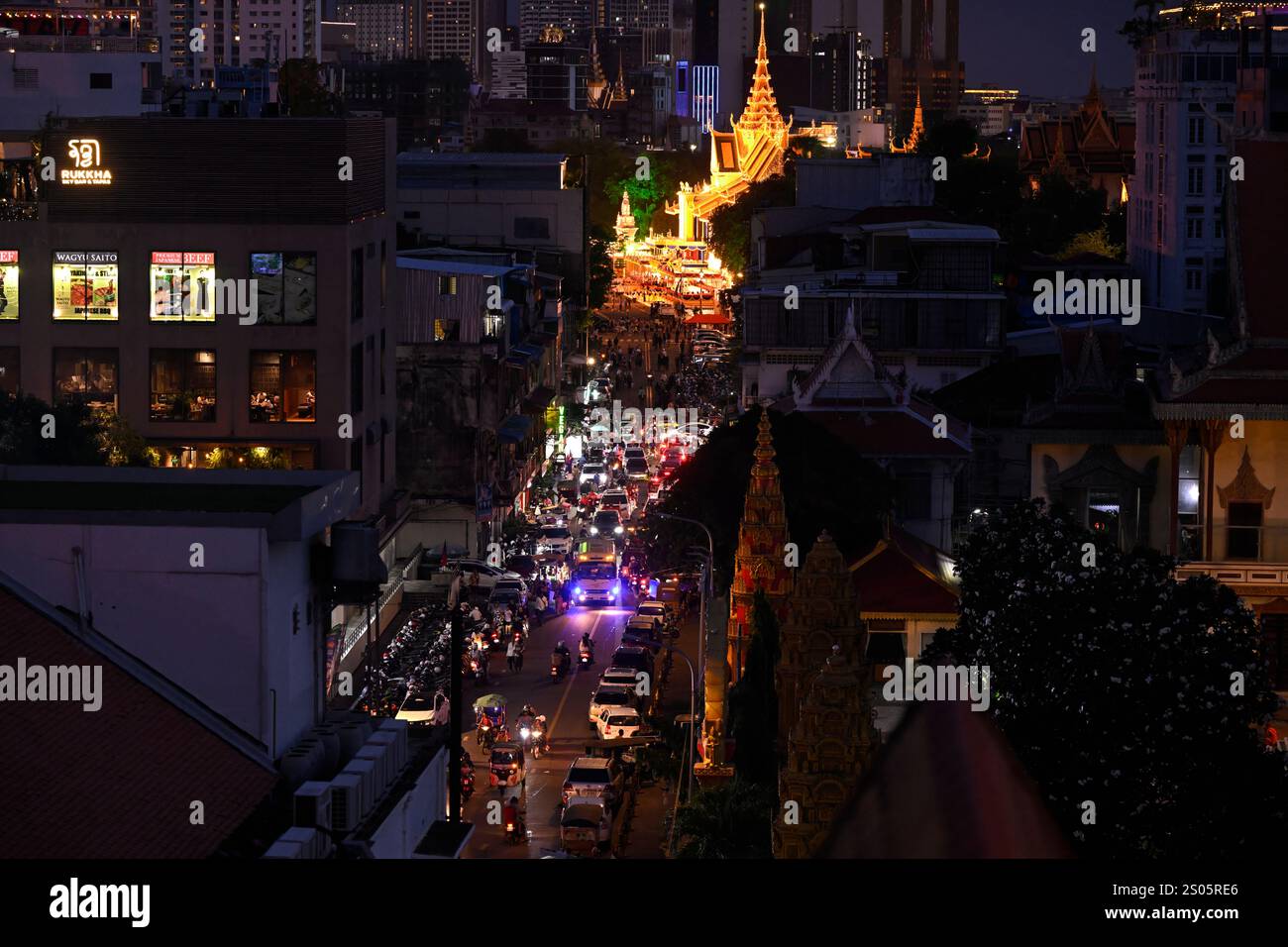 A traffic jam at night in the riverside area of Phnom Penh, Cambodia ...