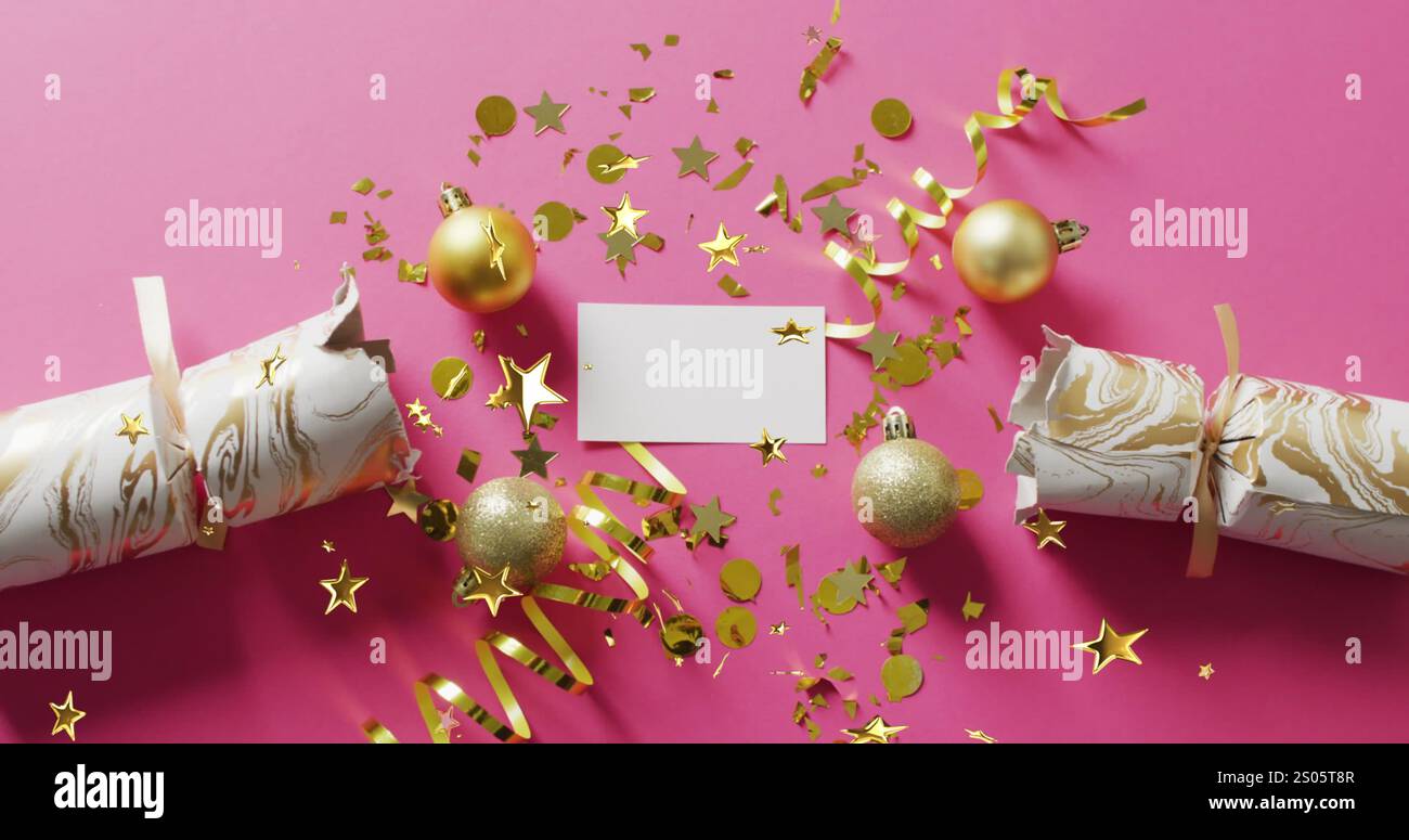 Image of gold stars falling, baubles and crackers. New year's eve ...