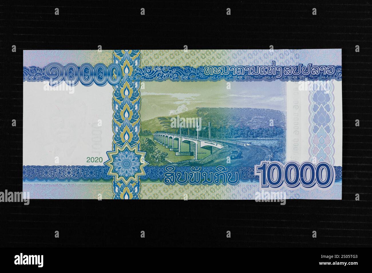 Laos 10,000 Kip banknote features mekong river, pha that luang pagoda ...