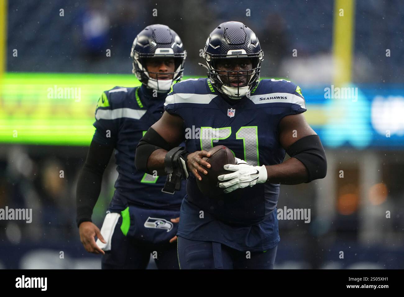 Seattle Seahawks center Olu Oluwatimi warms up before an NFL football ...
