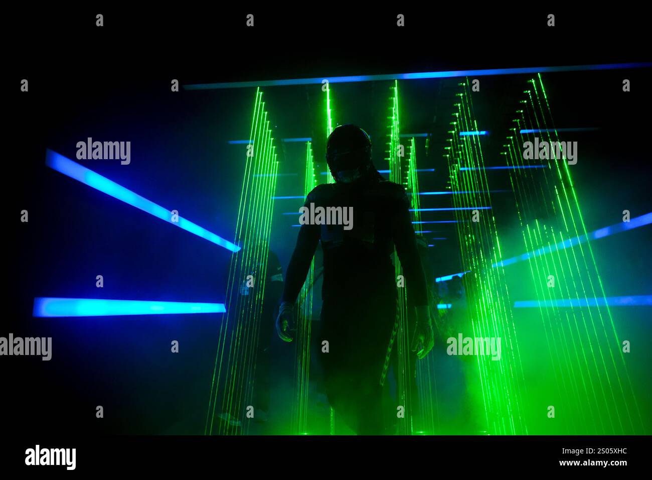 Seattle Seahawks defensive end Mike Morris walks through lasers in the ...