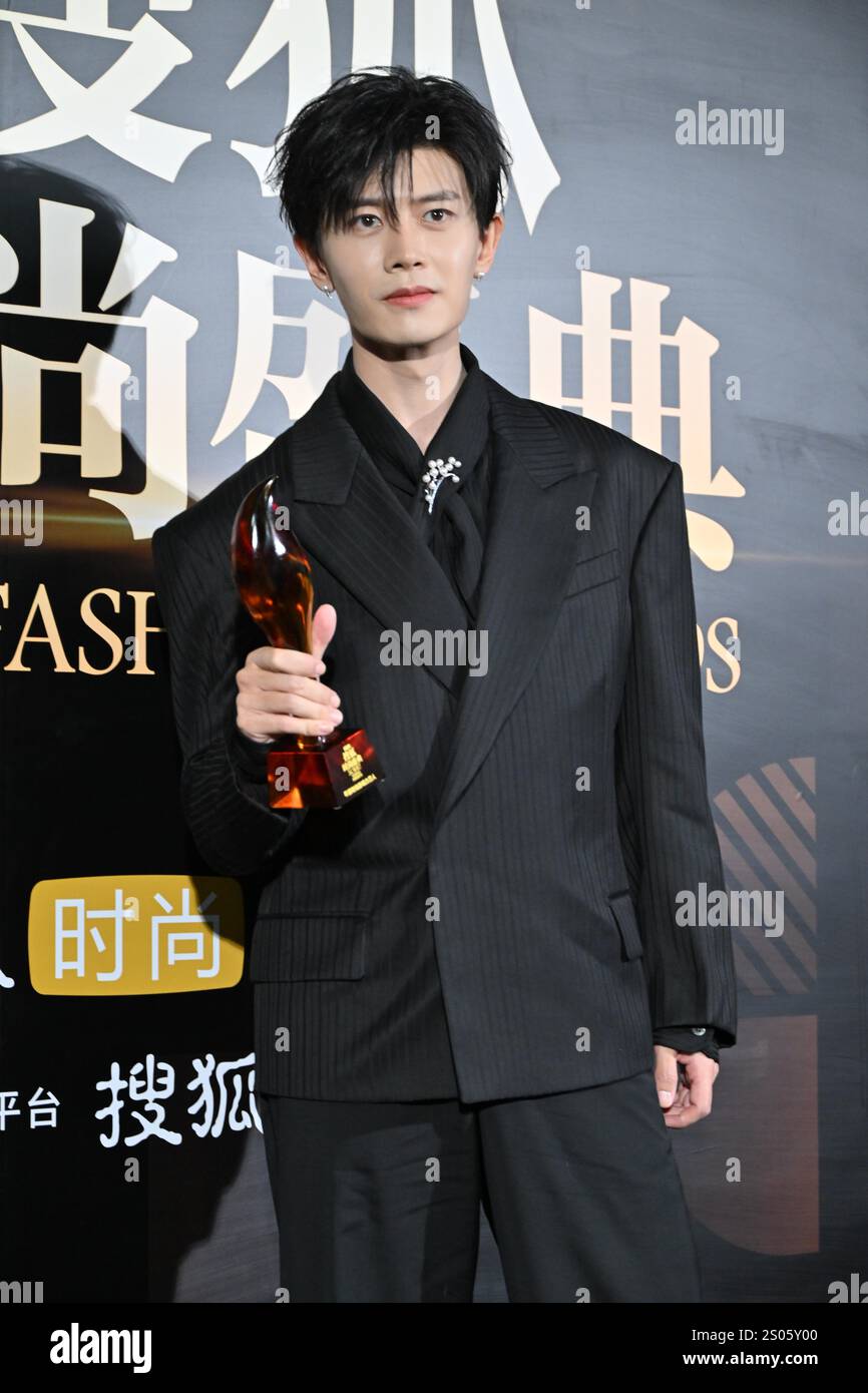 Chinese actor and singer Ren Jialun attends an activity in Beijing ...