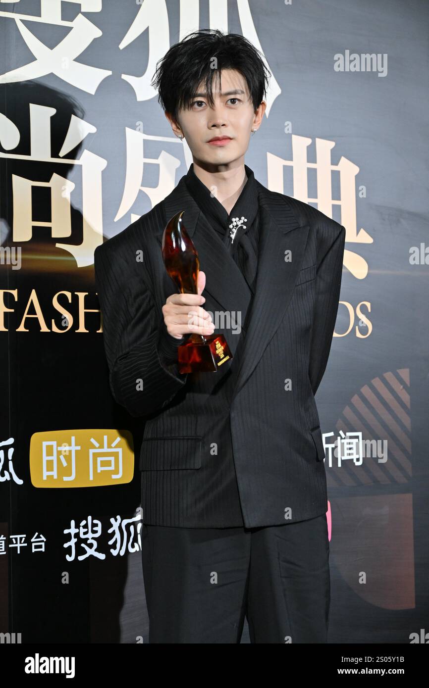 Chinese actor and singer Ren Jialun attends an activity in Beijing ...