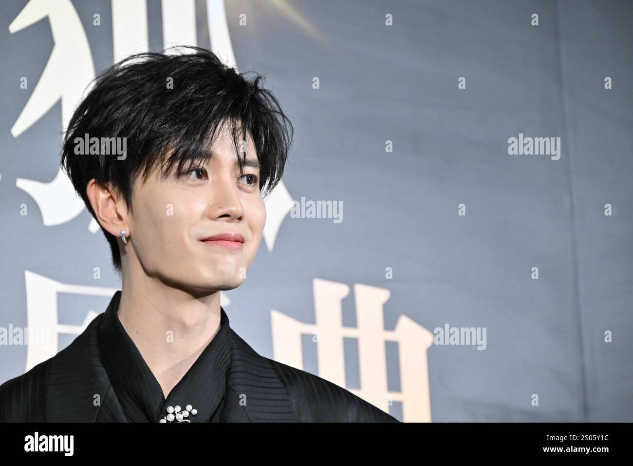 Chinese actor and singer Ren Jialun attends an activity in Beijing ...
