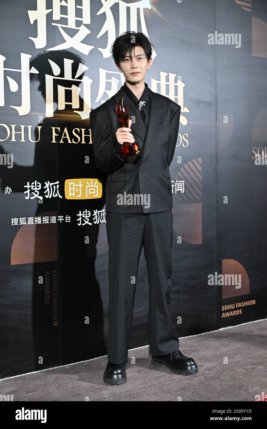 Chinese actor and singer Ren Jialun attends an activity in Beijing ...