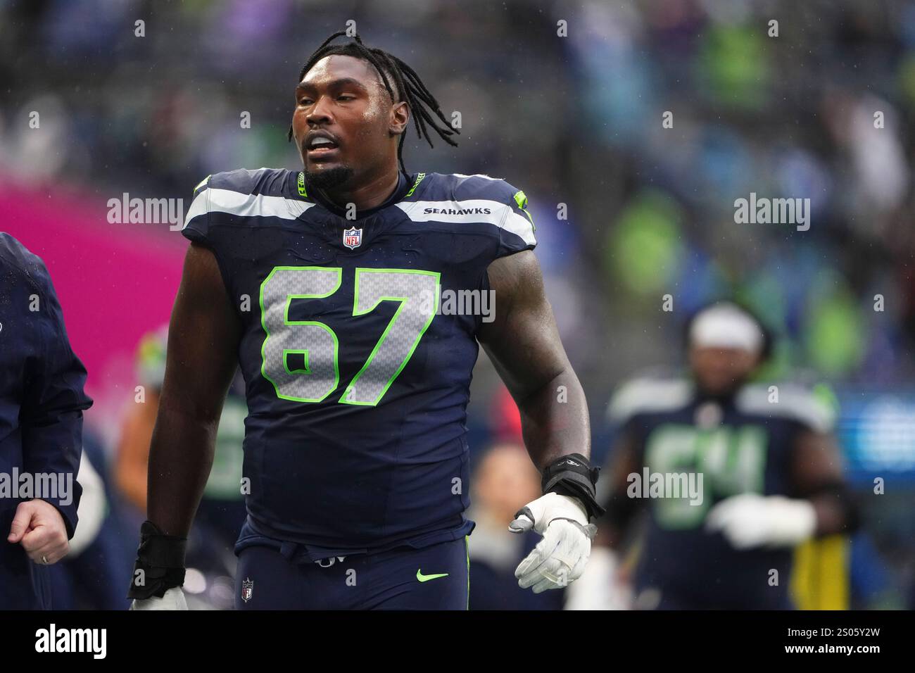 Seattle Seahawks offensive tackle Charles Cross runs off the field ...