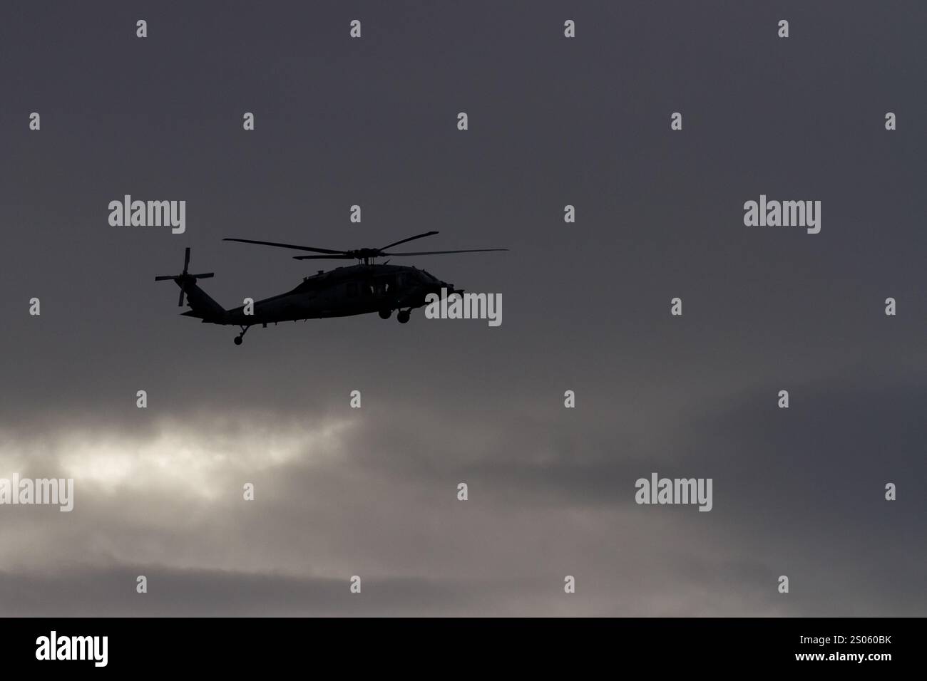 Silhouette of a Sikorsky SH-60 Seahawk helicopter with the US Navy ...