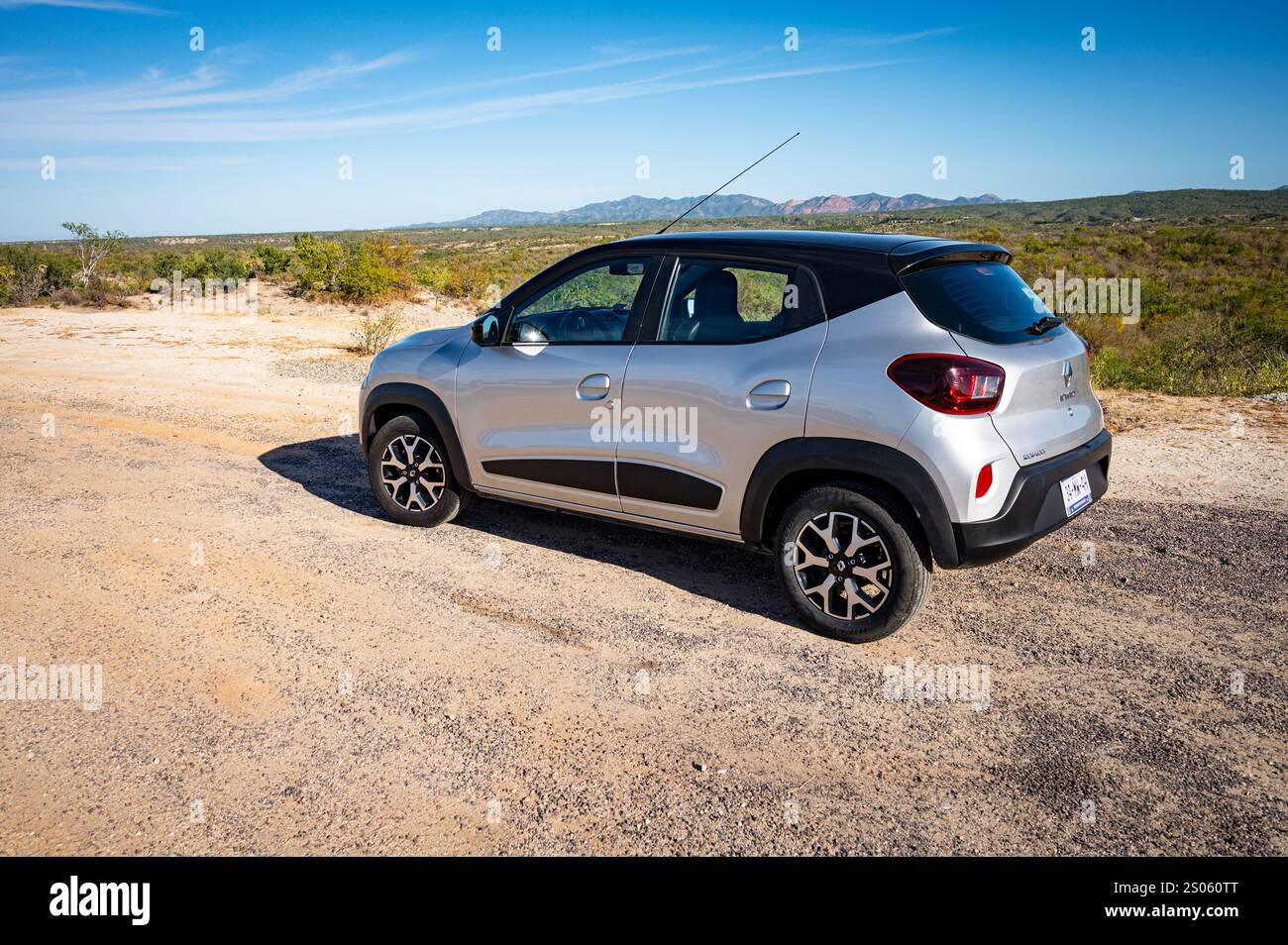 Photo of a tiny manual Renault KWID rental car, parked on the side of ...