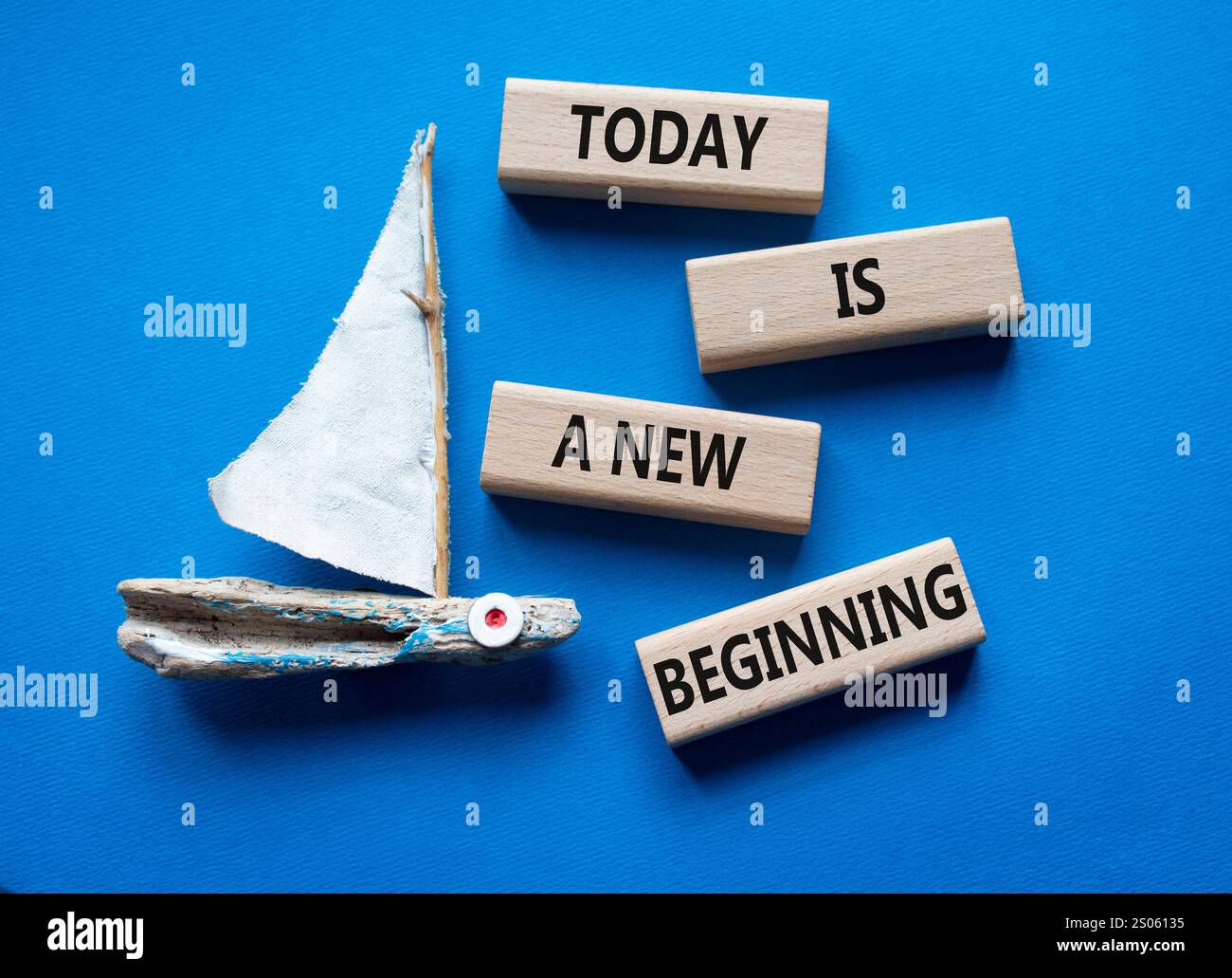 Today is a new beginning symbol. Wooden blocks with words Today is a ...