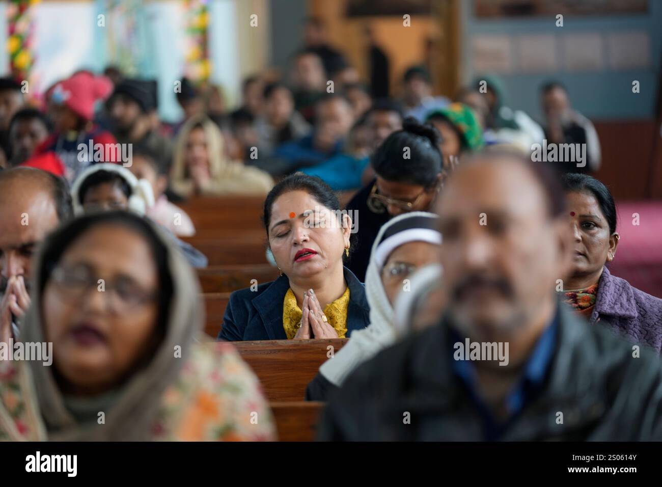 Indian Christians attend prayers during Christmas at St. Mary's ...