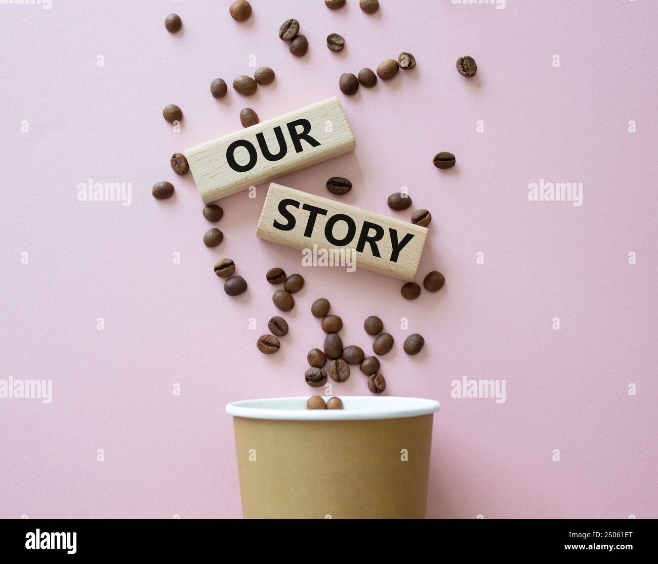 Our story symbol. Wooden blocks with words Our story Beautiful pink ...