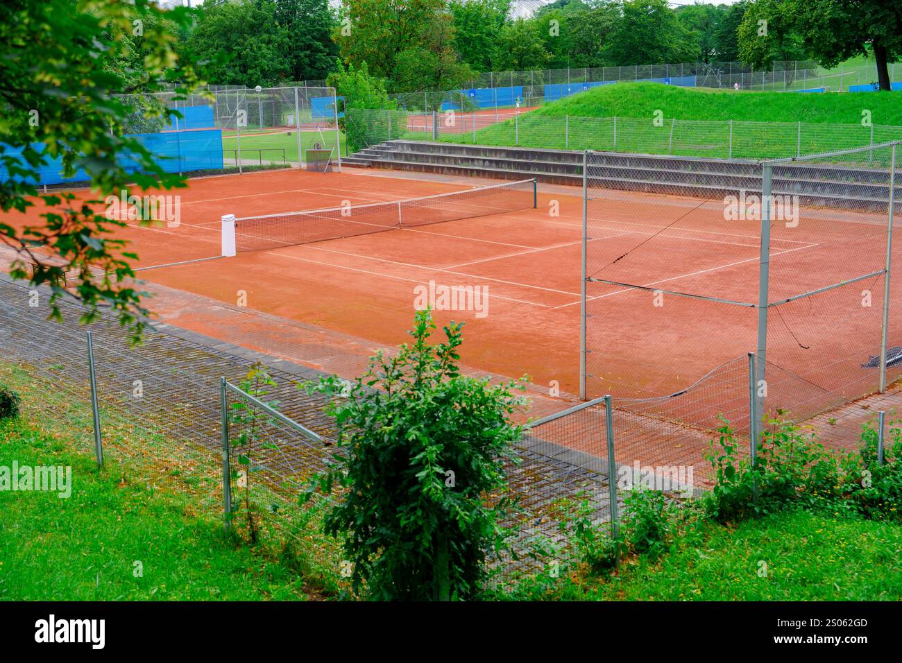 Beautiful Outdoor Tennis Court with Clay Surface in Serene Green ...