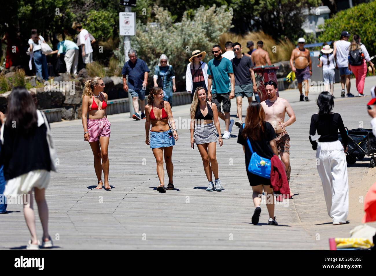 Melbourne, Australia. 25th Dec, 2024. People walk at the bank of St Kilda Beach during the ...