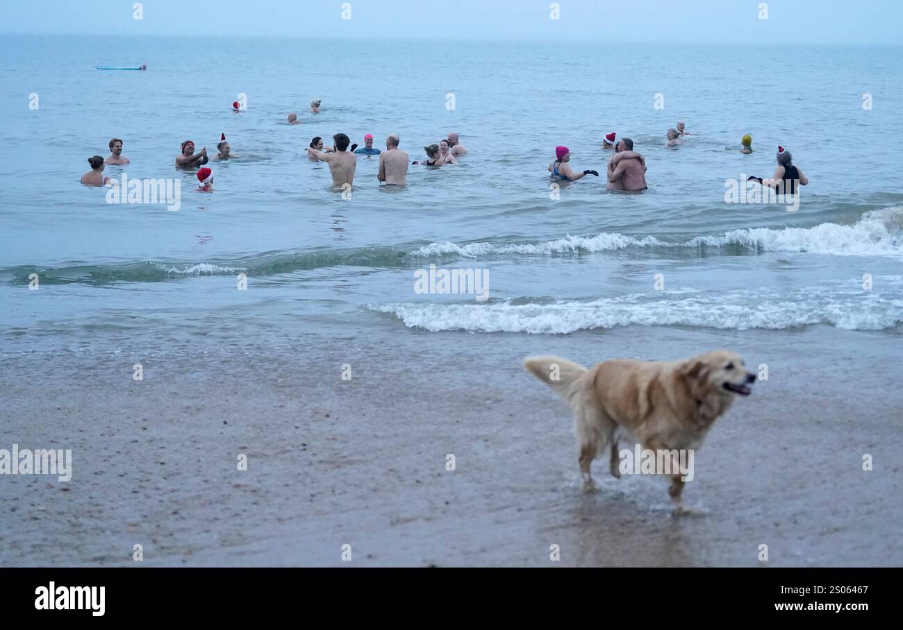 Swimmers take part in an early Christmas Day dip on Boscombe beach in ...