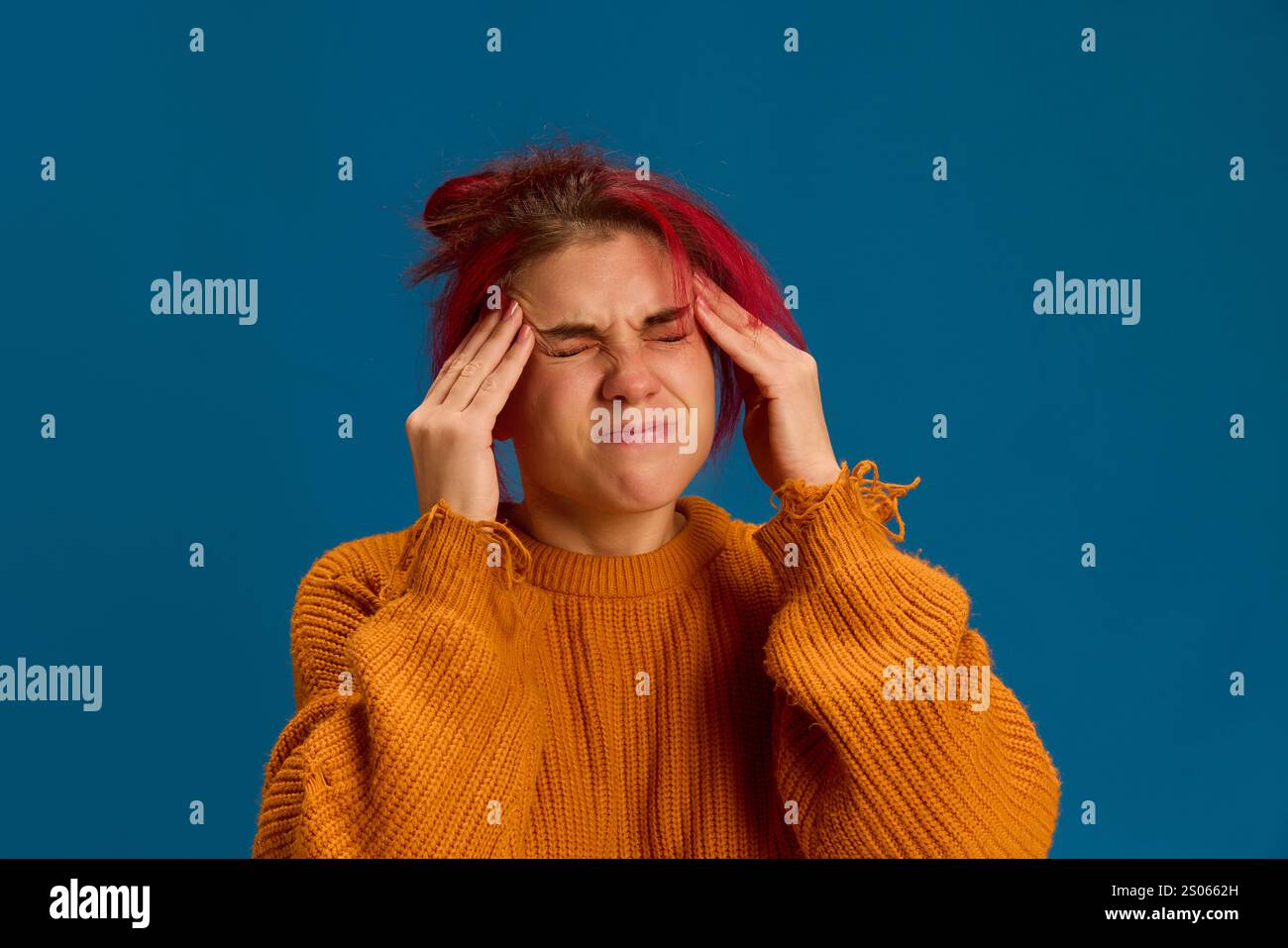 Woman with intense headache, pressing temples to relieve pain ...
