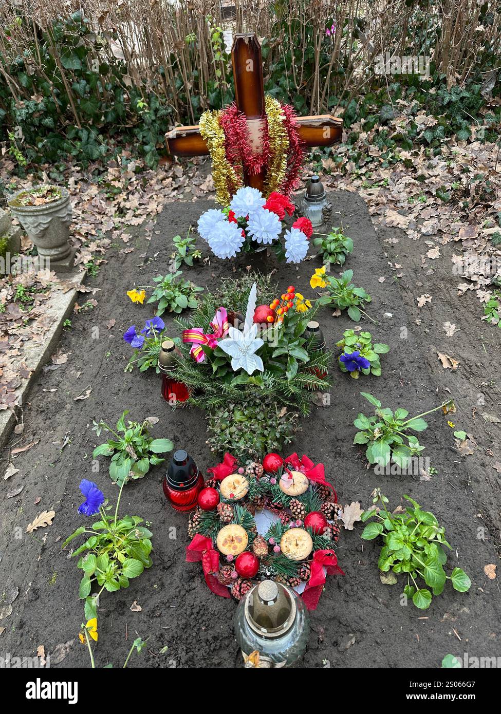 Christmas ornaments on the tombstone in the public cemetery Stock Photo ...