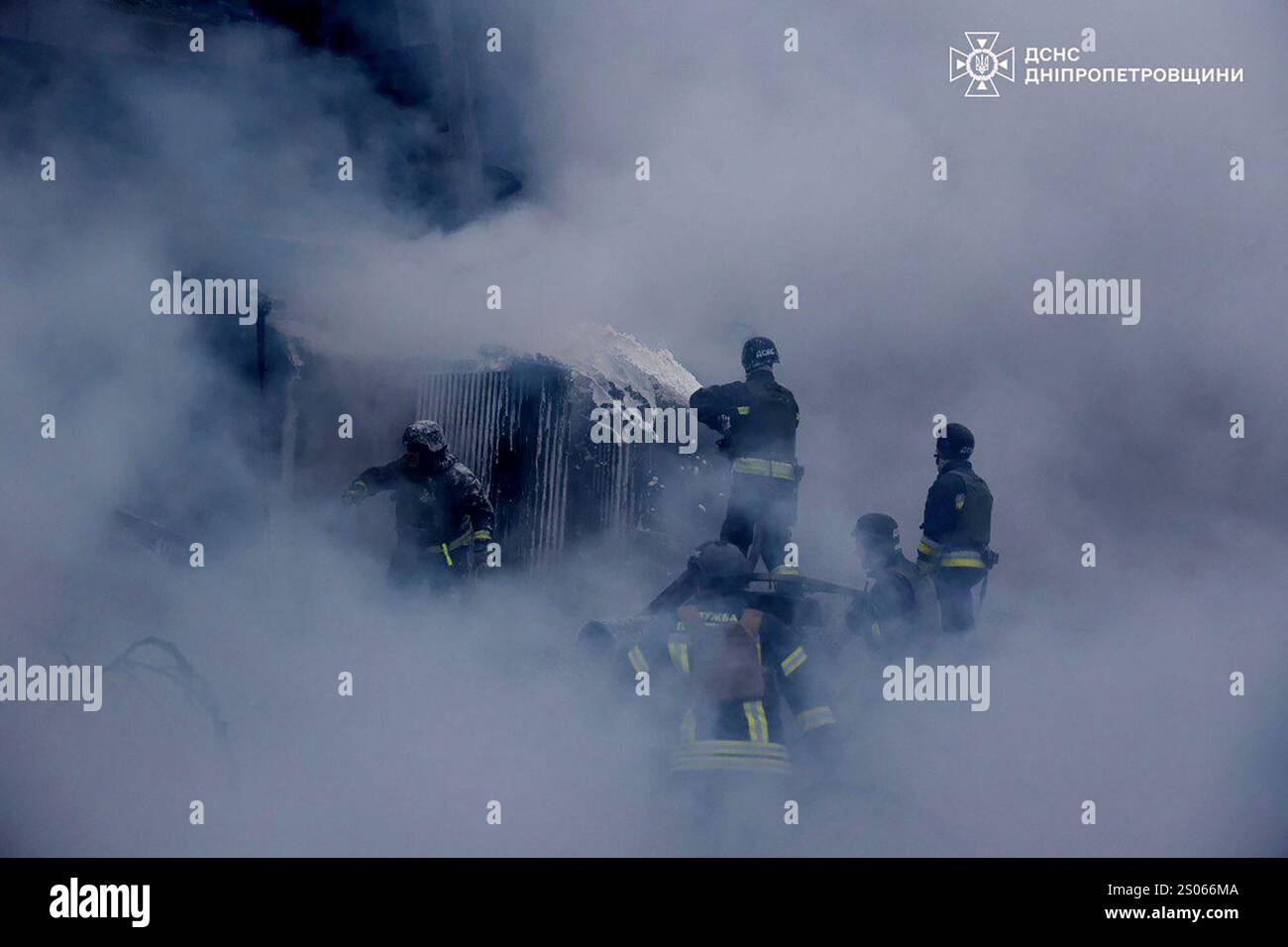 In this image provided by the Ukrainian Emergency Service, firefighters ...