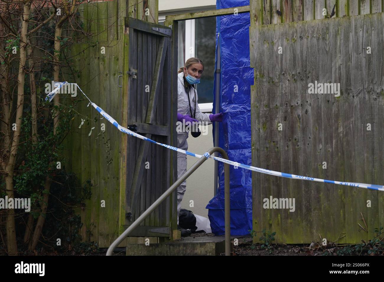 A forensic investigator at the scene on Fownhope Close in Redditch ...