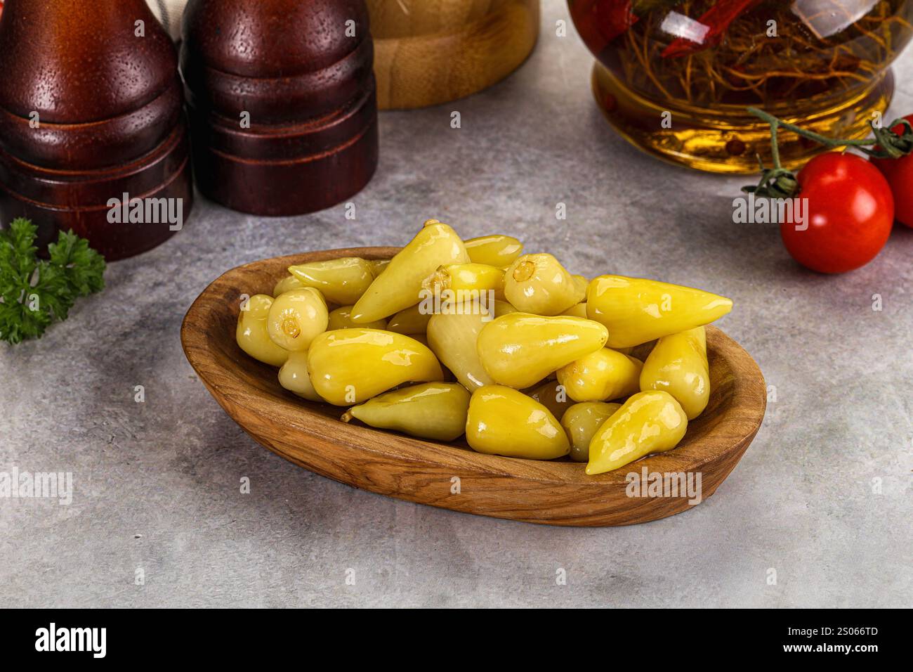Turkish traditional marinated mini yellow chili peppers Stock Photo - Alamy