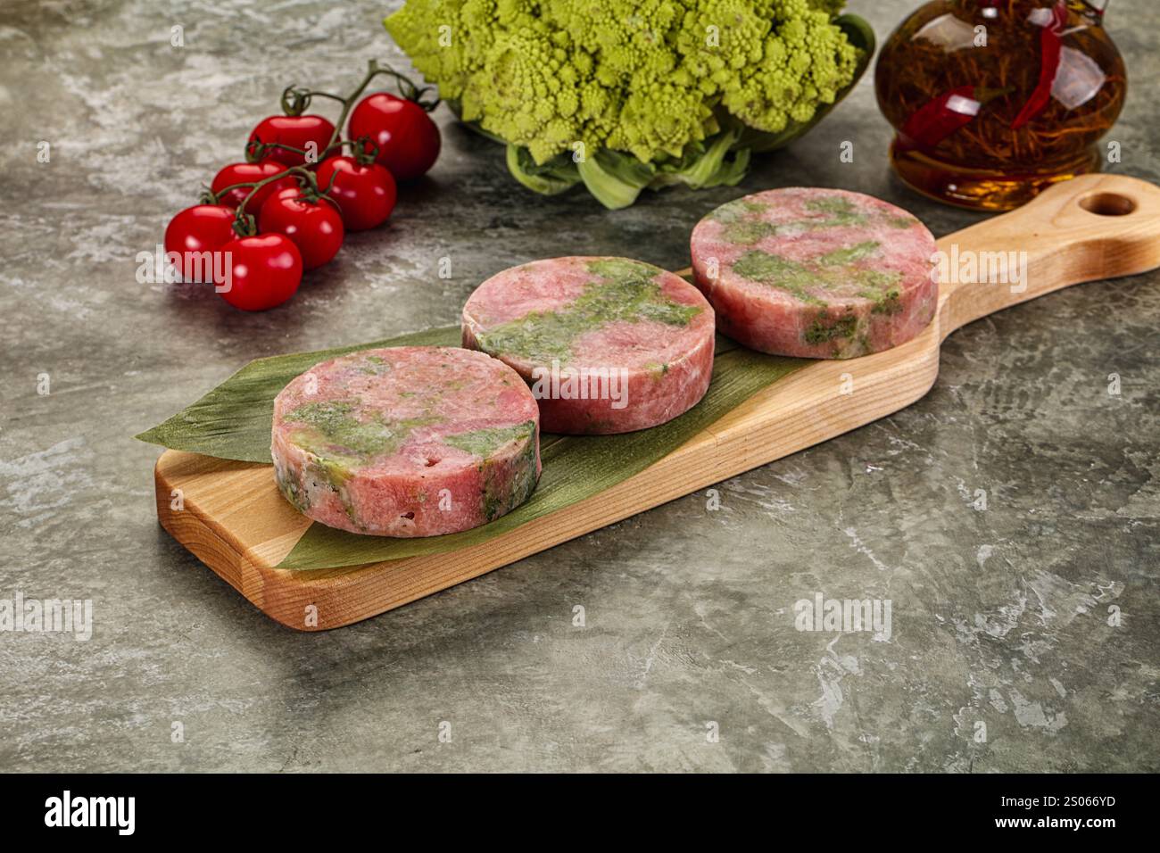 Raw Tuna medallion with broccoli cabbage Stock Photo - Alamy
