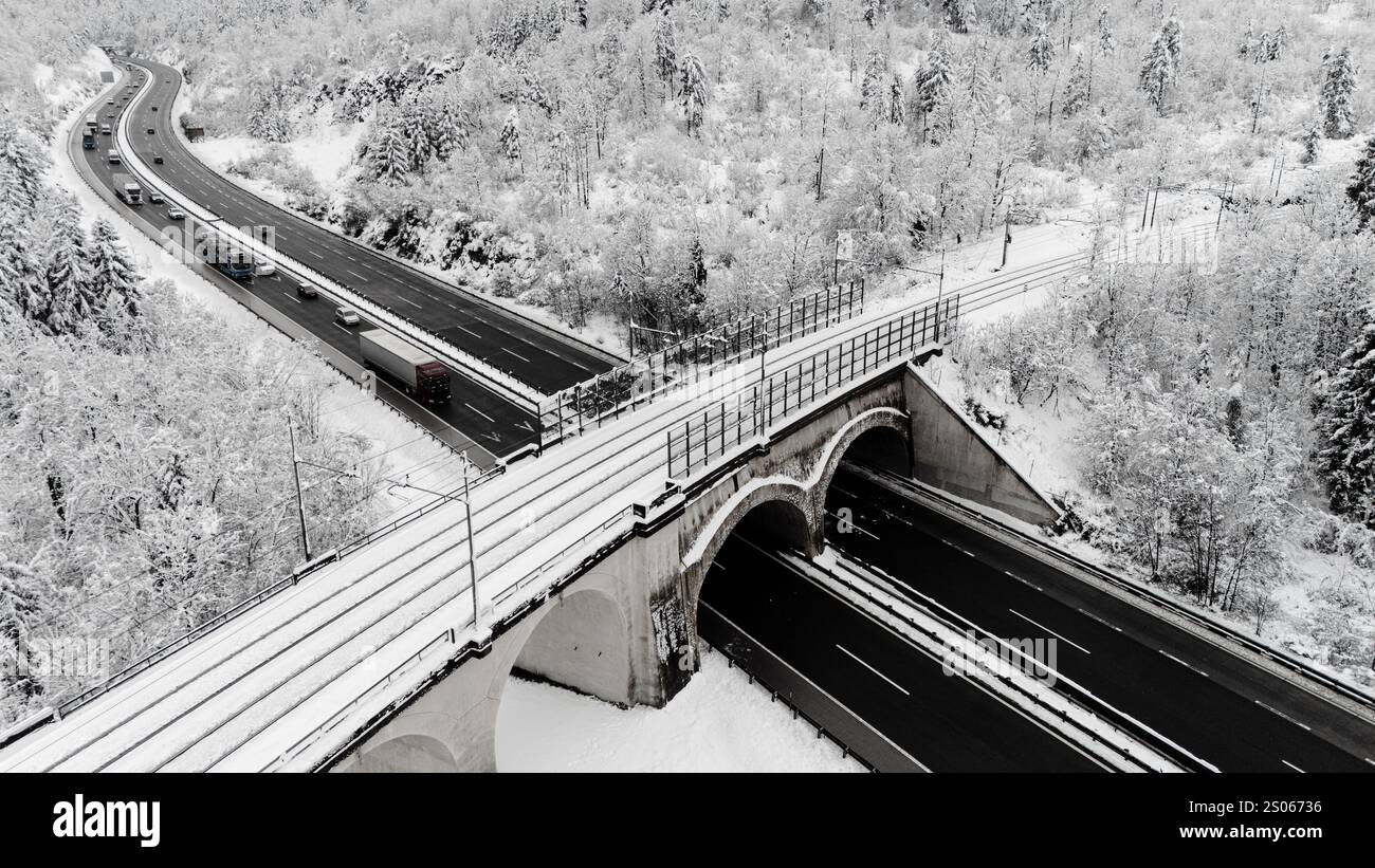 Snowy Highway and Railway Intersection in Winter Stock Photo - Alamy
