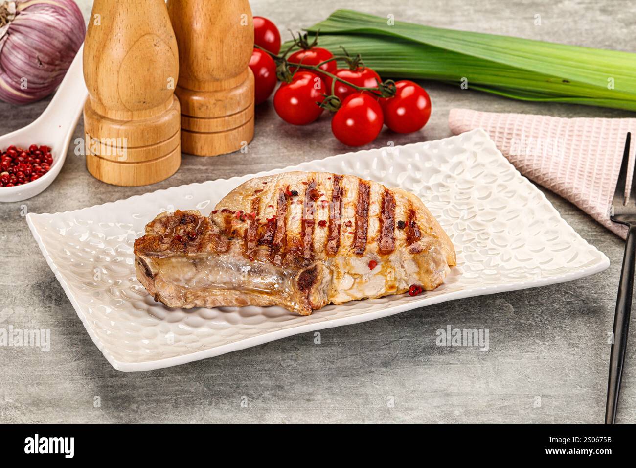 Grilled fat pork loin steak with bone Stock Photo - Alamy