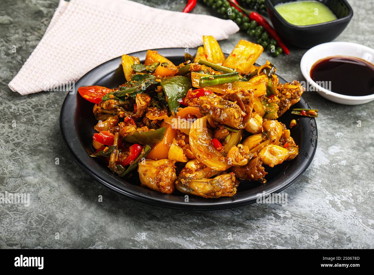 Vietnamese cuisine - fried frog with vegetables and spices Stock Photo ...
