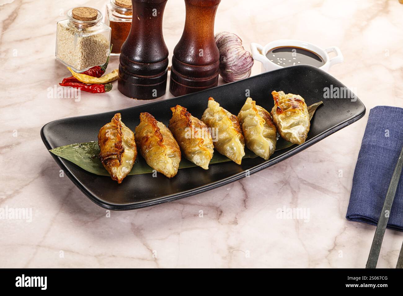 Fried Japanese stuffed dumplings - Gyoza with meat Stock Photo - Alamy
