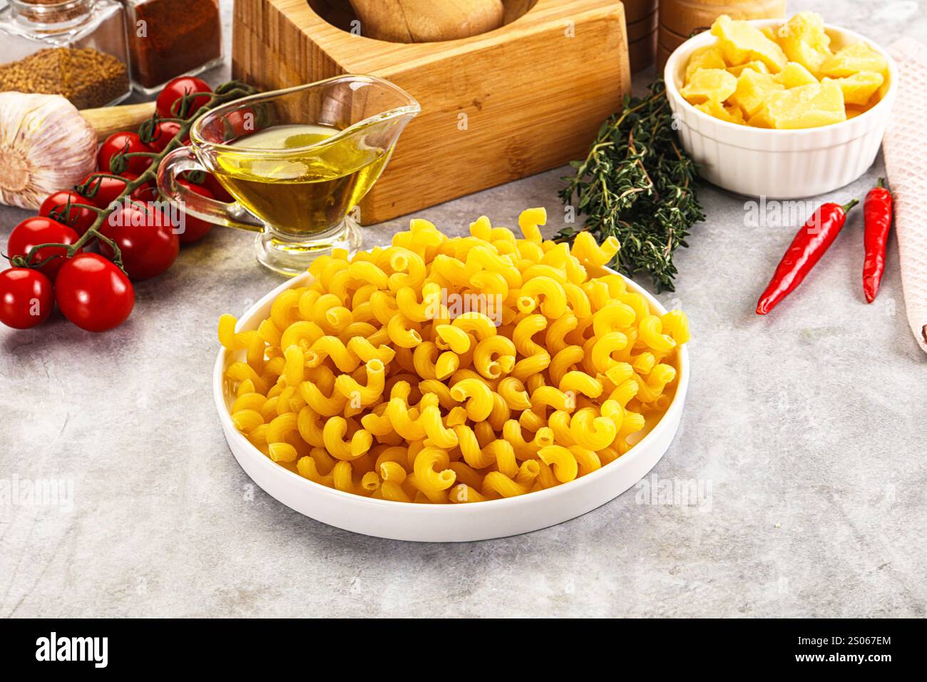 Italian cuisine - dry cellentani pasta for cooking Stock Photo - Alamy