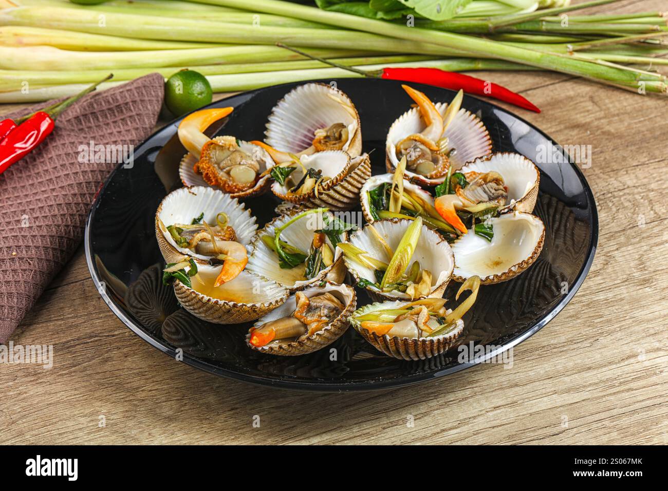 Delicous Asian mollusk shell steamed with spices Stock Photo - Alamy