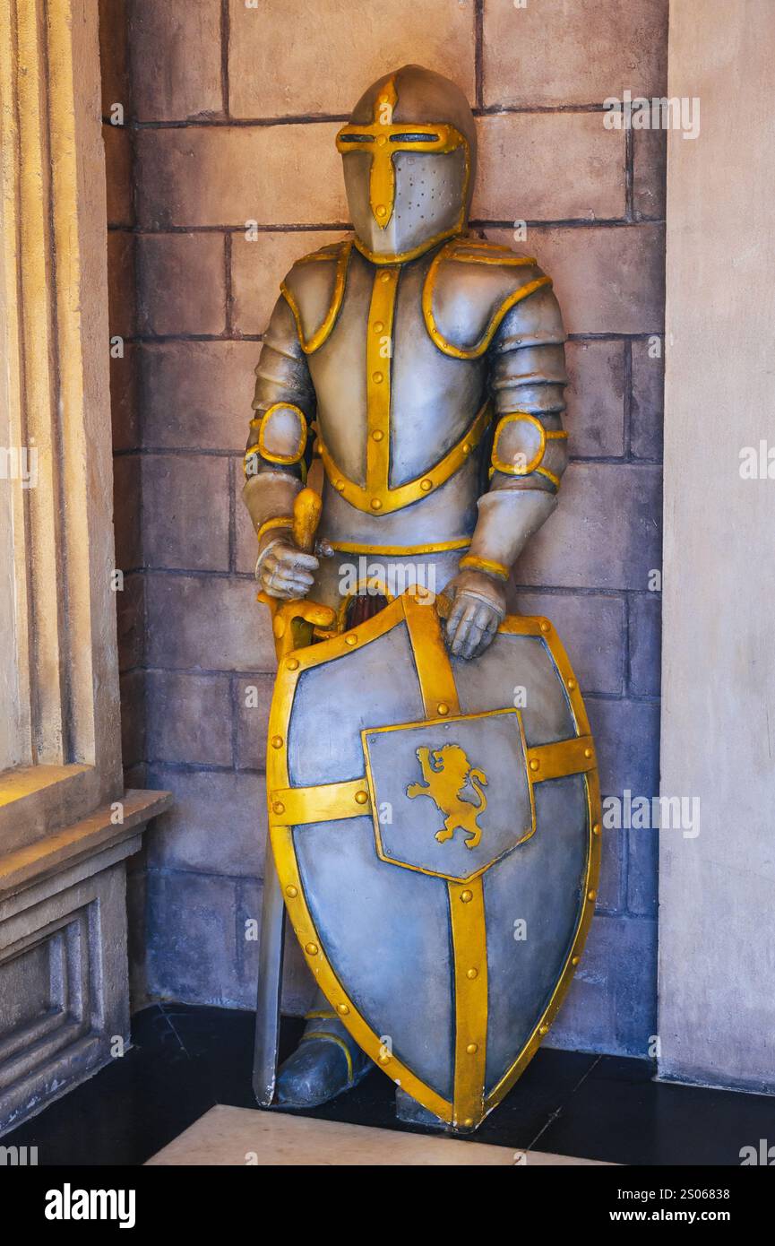 statue of medieval European knight in armor with a sword and shield in ...