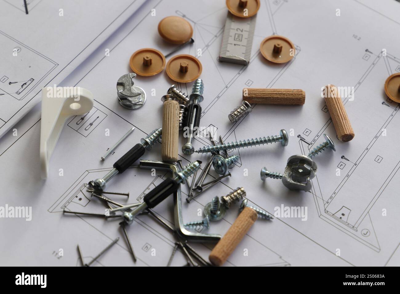 an assembly manual for furniture with screws and dowels Stock Photo - Alamy