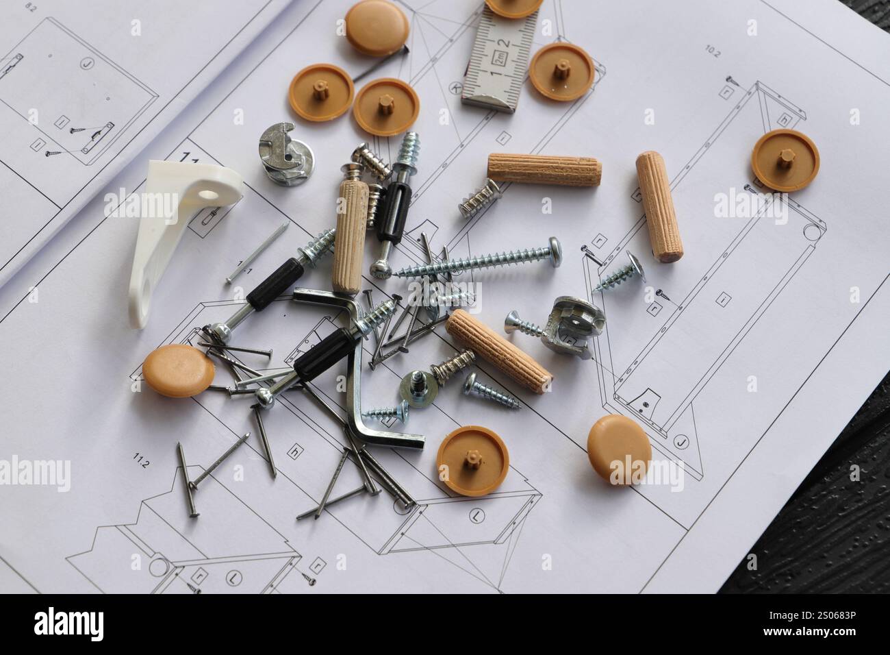 an assembly manual for furniture with screws and dowels Stock Photo - Alamy