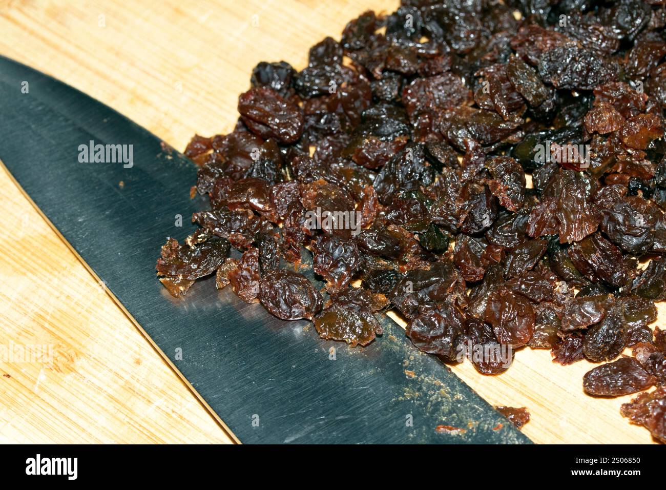 Close Up of Chopped Saltanas Raisins with Knife on Chopping Board Stock ...
