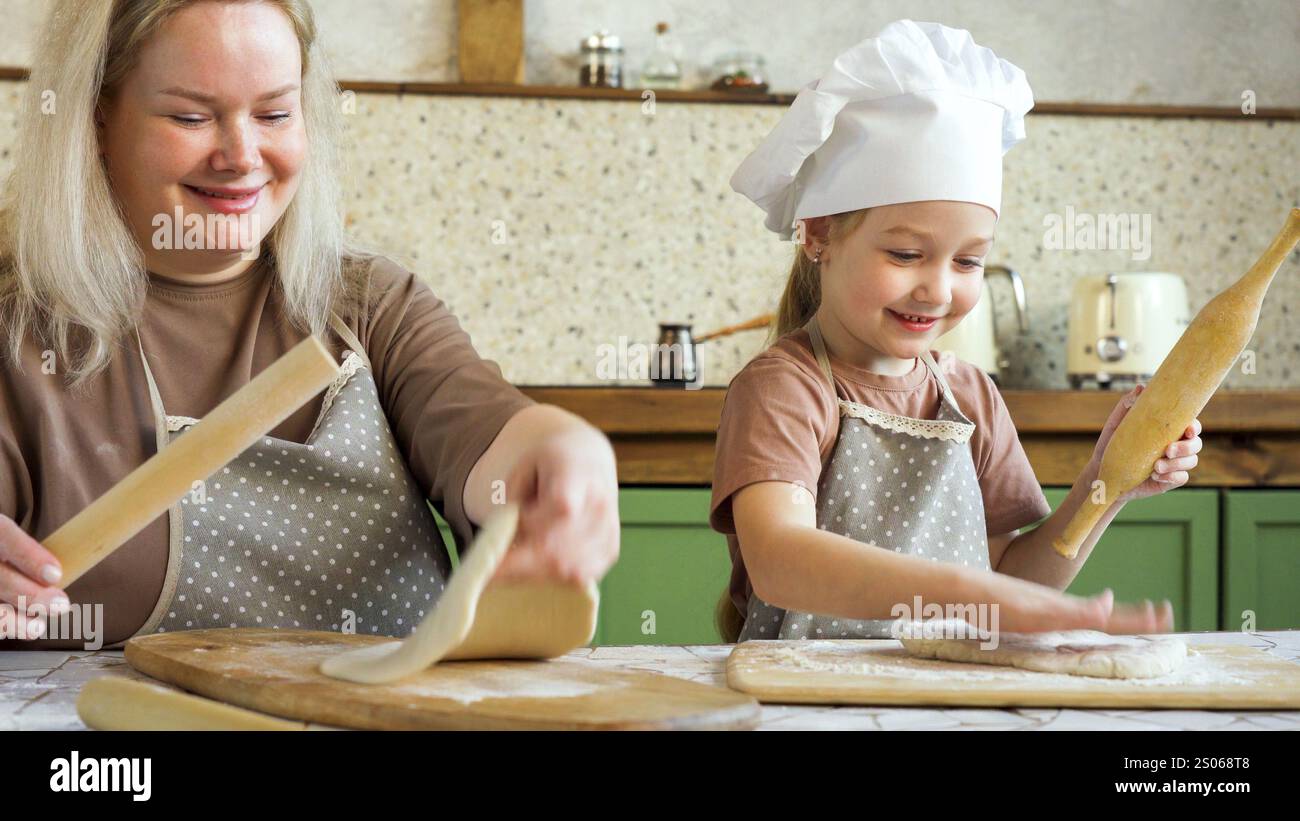 Baking joy with a rolling pin and flour-covered hands Stock Photo - Alamy