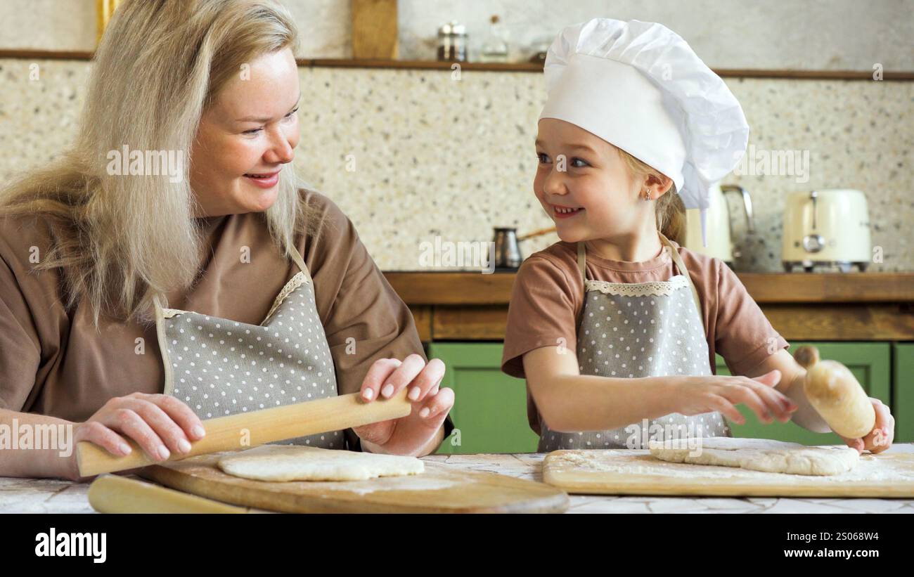 Sharing a happy moment while baking Stock Photo - Alamy