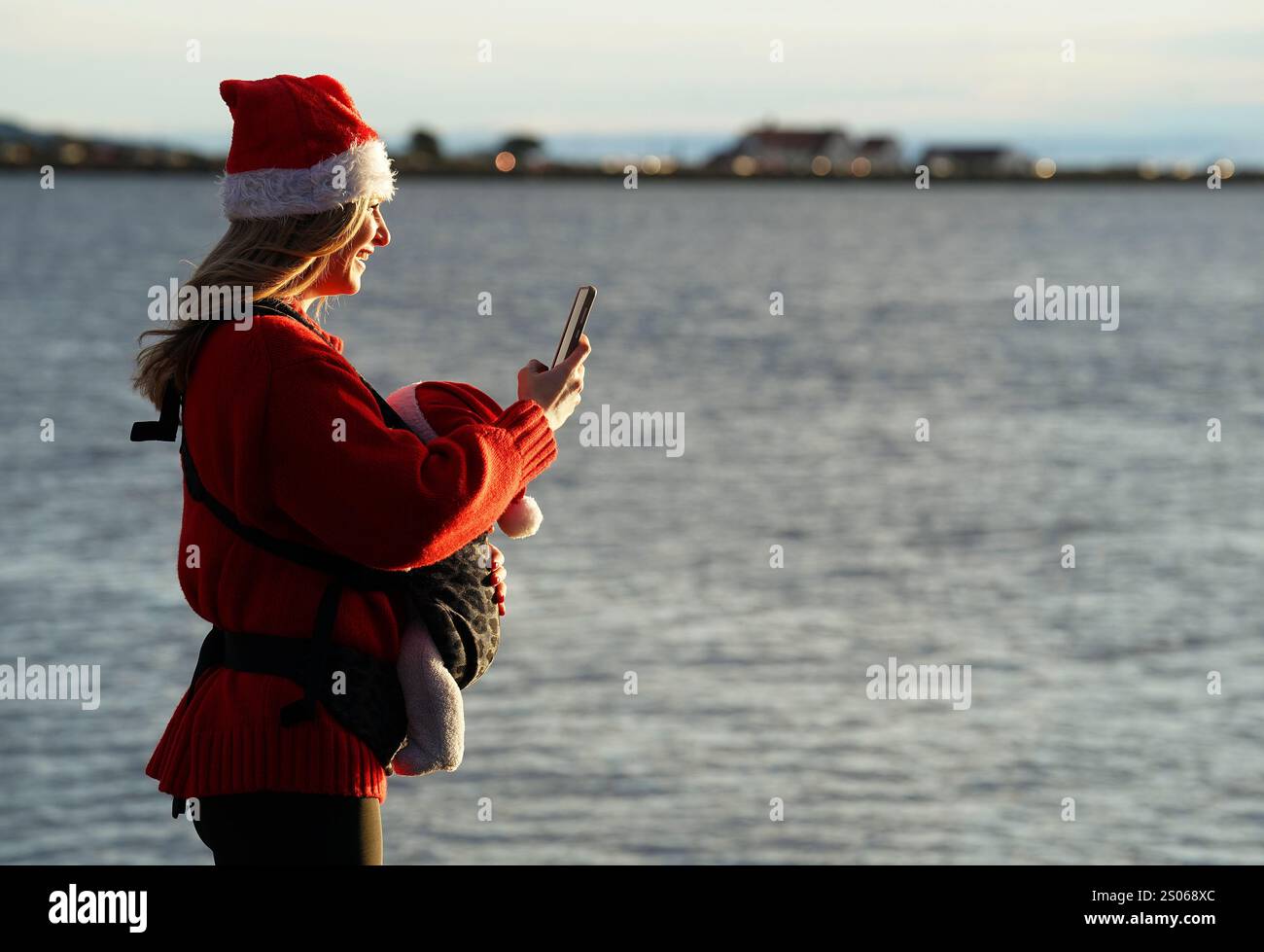 Jill Owens and her ten-week-old daughter Maisie Mulligan look on during ...